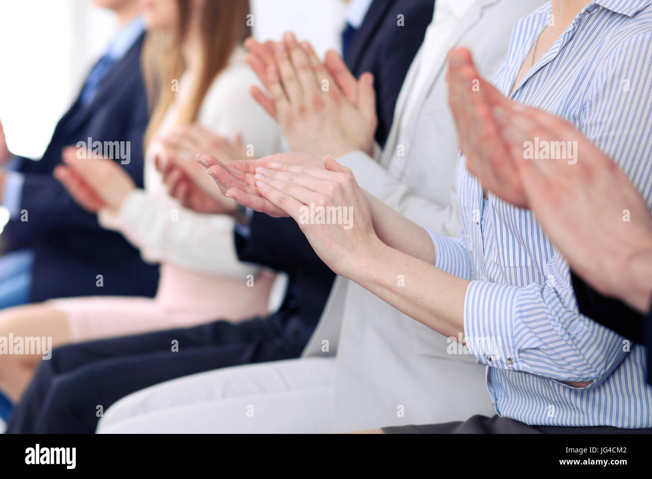 Close up of business people hands clapping at conference Stock Photo ...