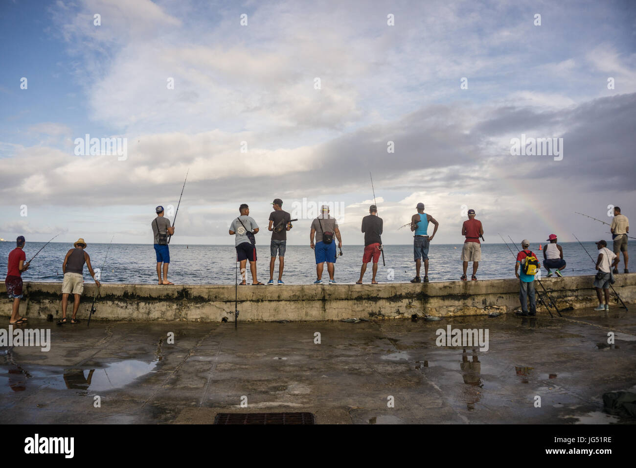 Cuban men fishing from the promenade in Havana Stock Photo - Alamy