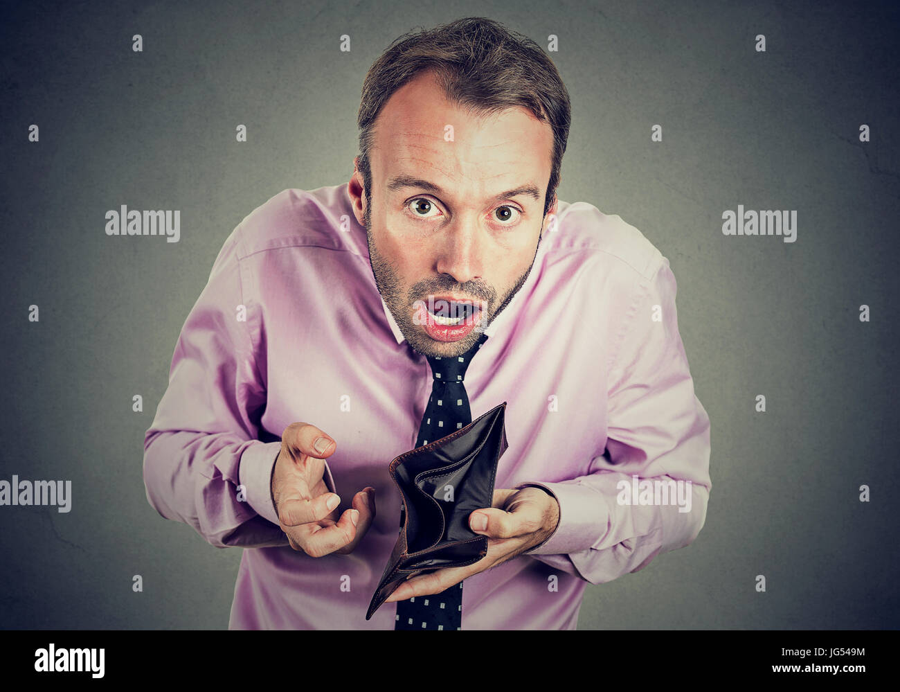 Man with no money. Businessman holding showing empty wallet Stock Photo ... Man with no money. Businessman holding showing empty wallet Stock Photo ...