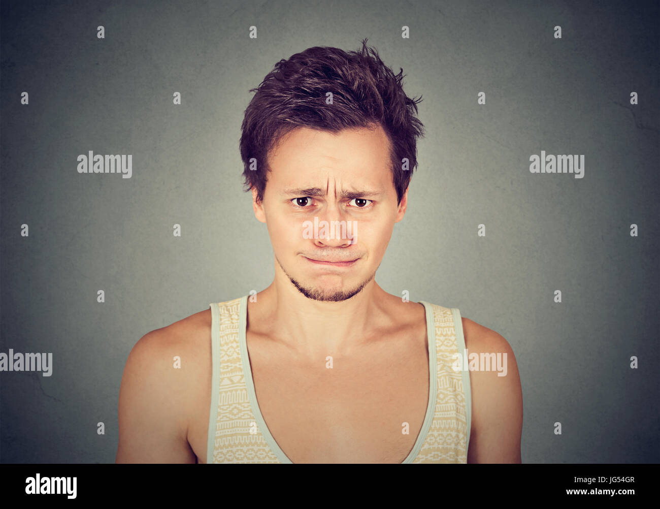 angry man about to have nervous breakdown isolated on gray background ...