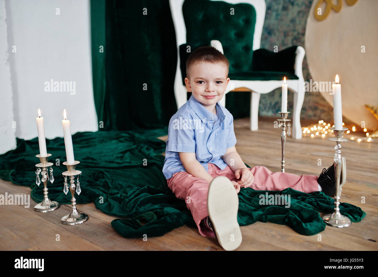 Portrait of an adorable little boy in official clothing posing with ...