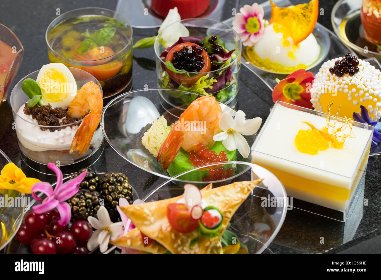 Canape desserts and snack in plastic cups Stock Photo - Alamy