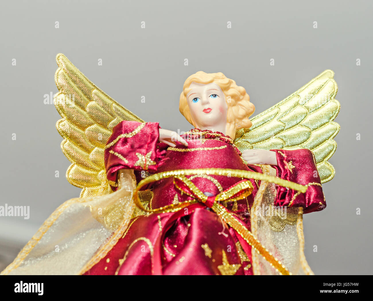 Angel Christmas tree ornament, topper, close up. Dressed angel with ...
