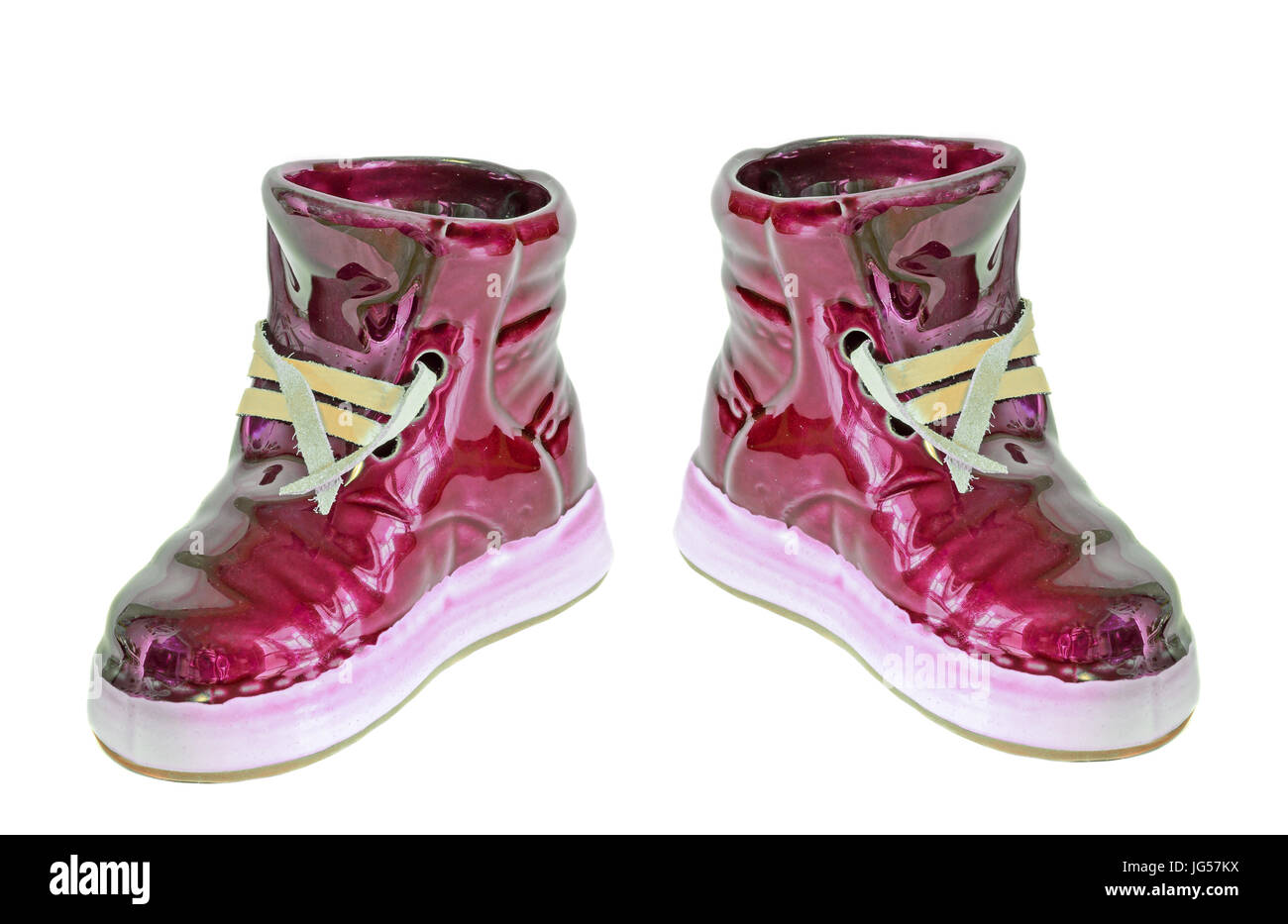 Red ceramic boots, sneakers, close up, isolated, white background Stock ...