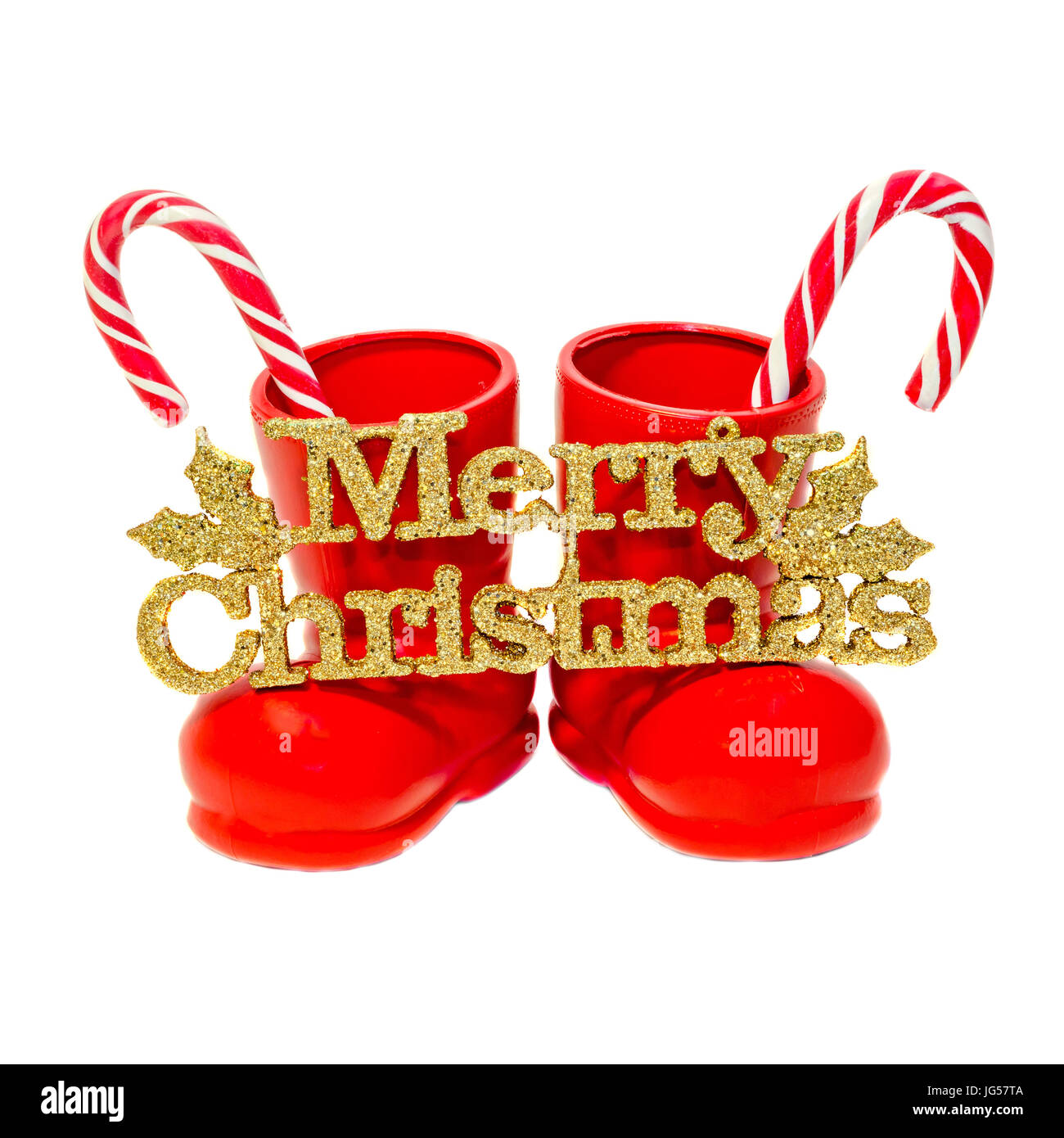Red Santa shoes with candy sticks and golden Merry Christmas write ...