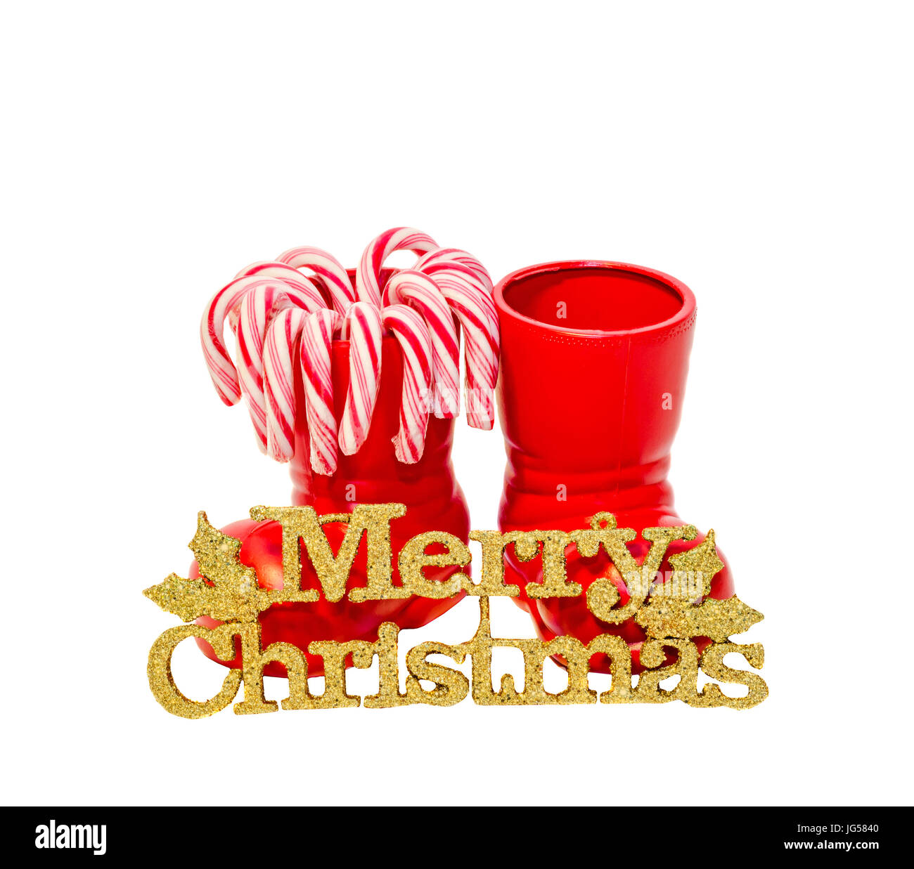 Red Santa shoes with candy sticks and golden Merry Christmas write ...