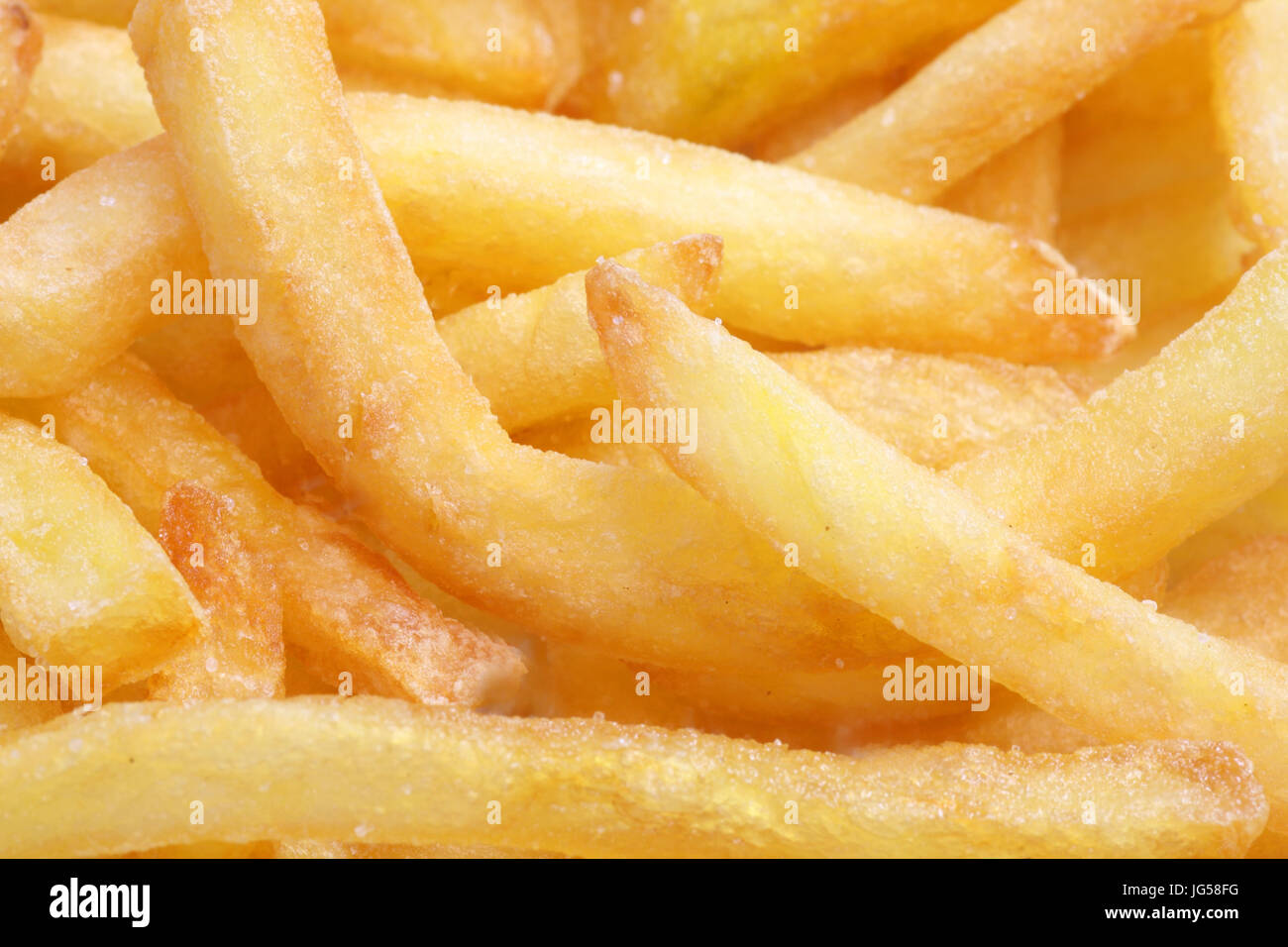 Crunchy French Fries in detail as background Stock Photo - Alamy