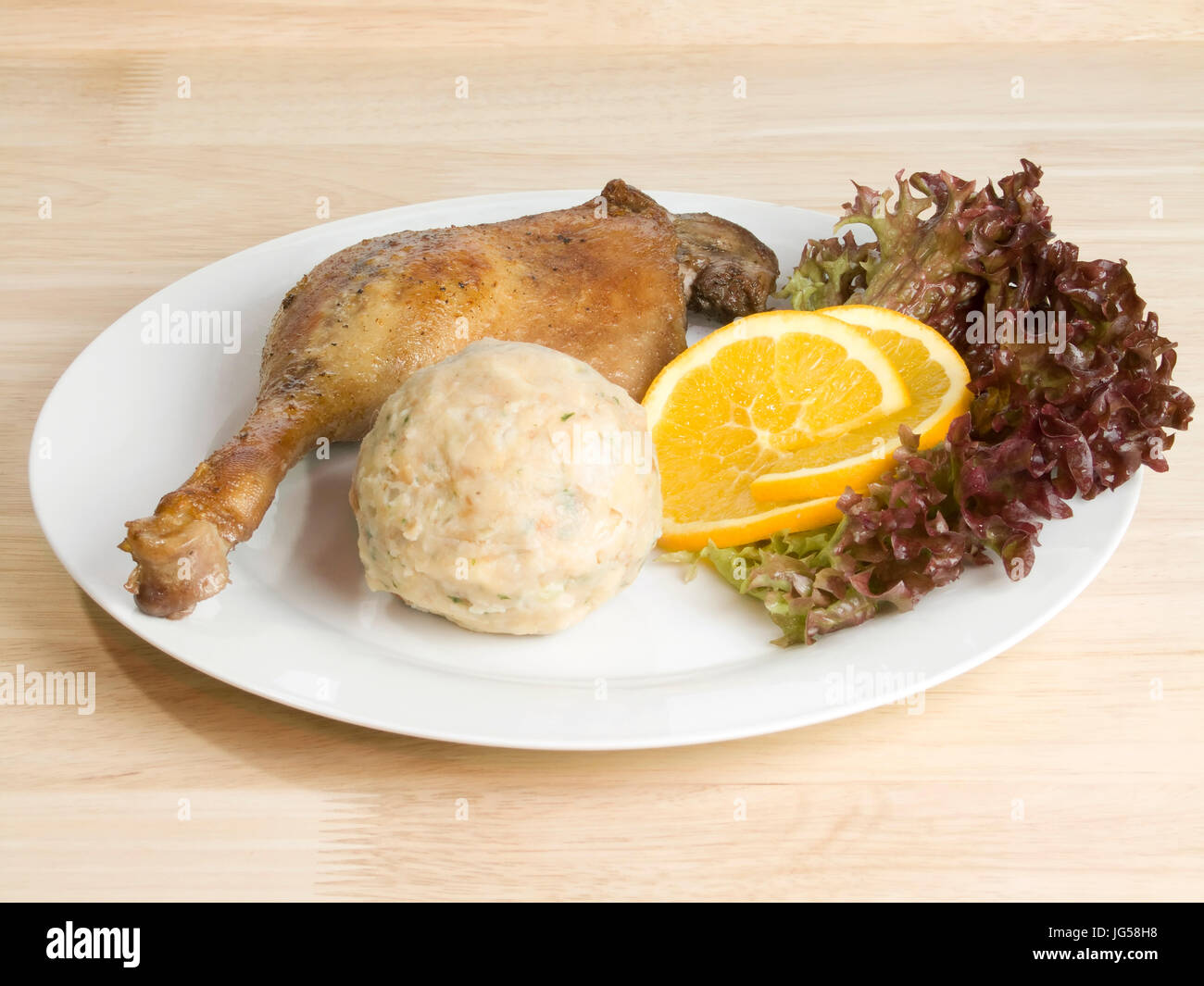 Roasted goose leg on bright background Stock Photo - Alamy