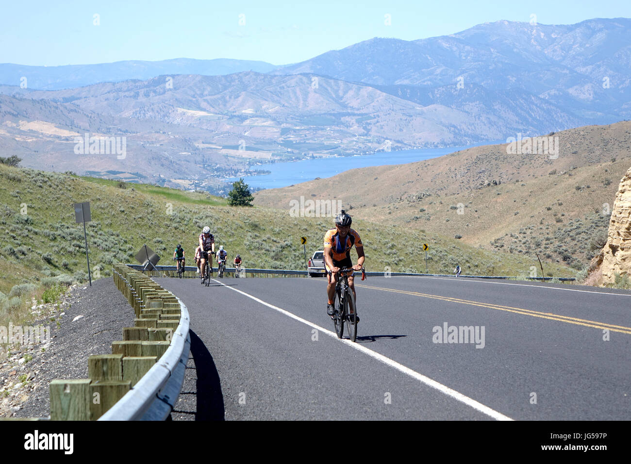 A group of riders climbing a hill Stock Photo - Alamy