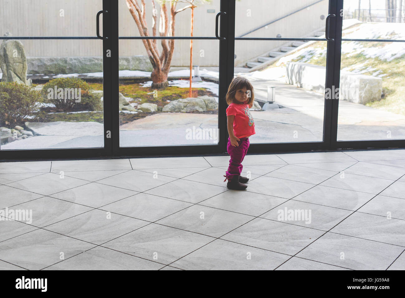 A little girl in a museum Stock Photo - Alamy
