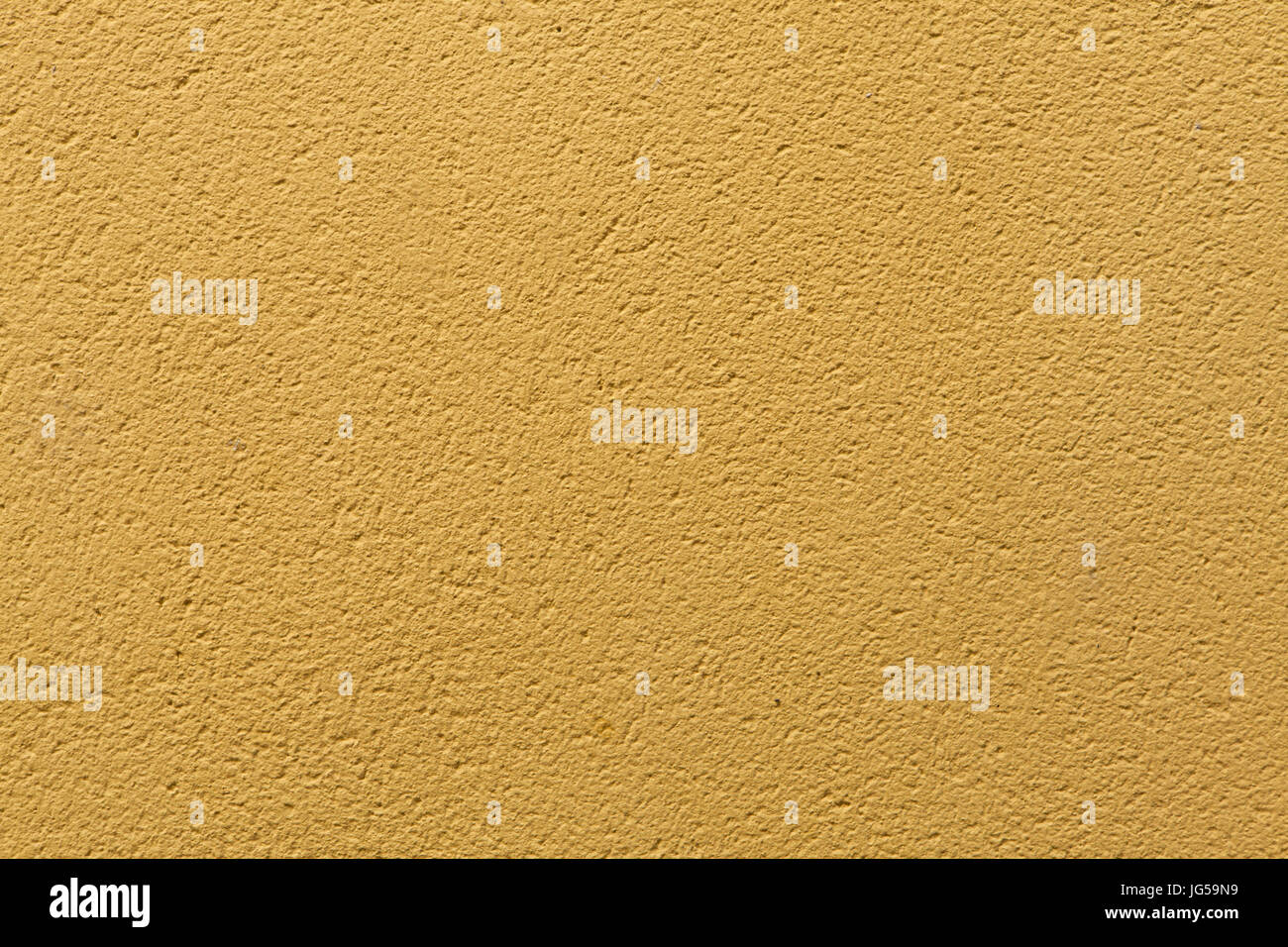 Yellow ochre painted stucco wall. Background texture Stock Photo - Alamy