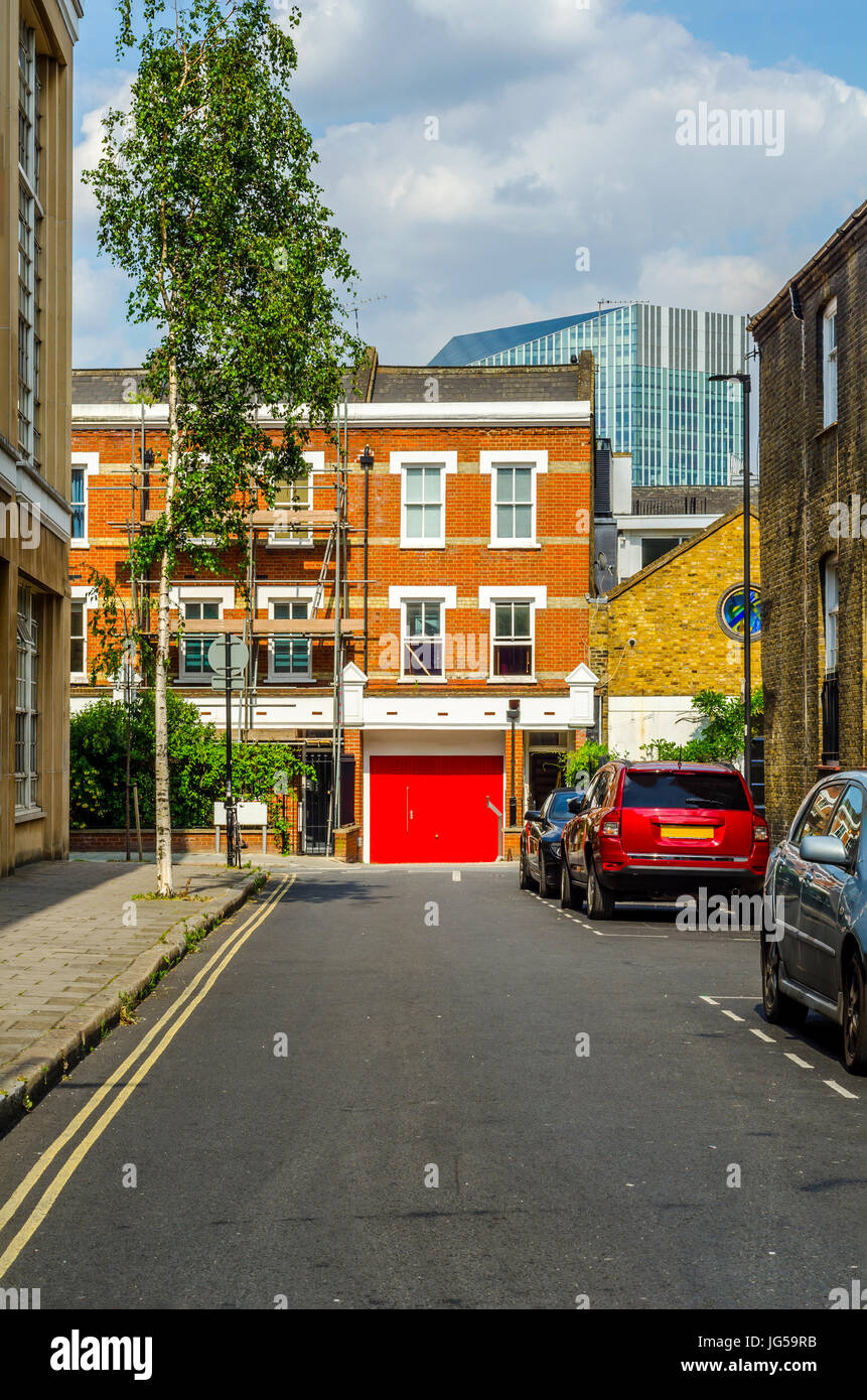 Typical English architecture, residential buildings in a row along the ...