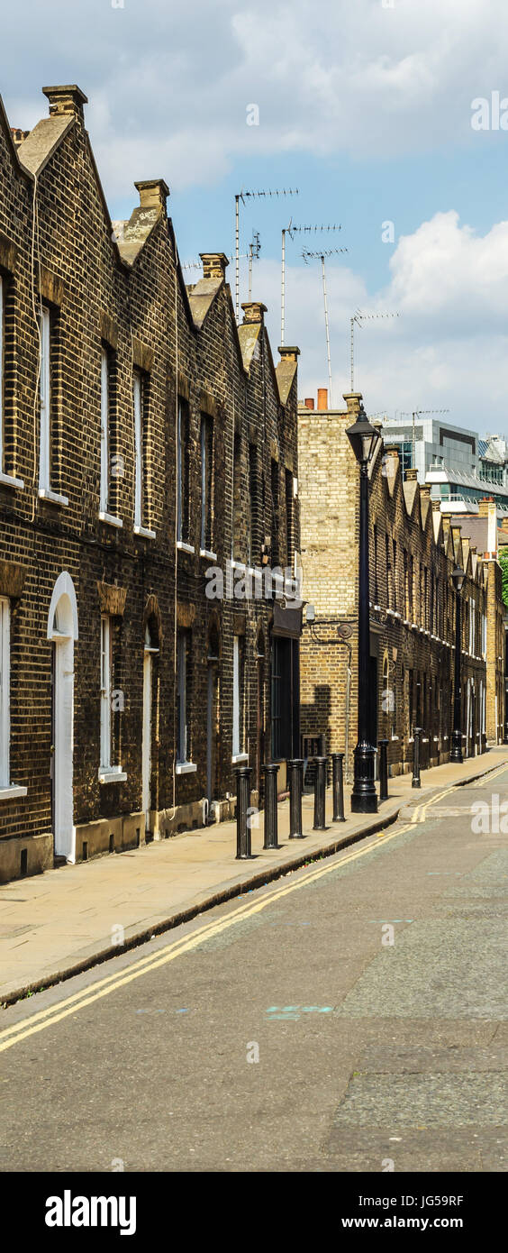 Typical English architecture, residential buildings in a row along the ...