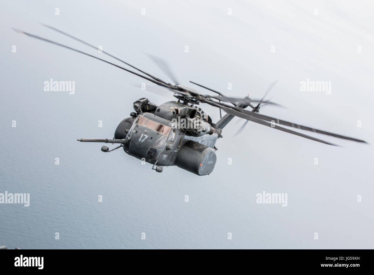 A U.S. Navy MH-53E Sea Dragon helicopter conducts an aerial refuel ...