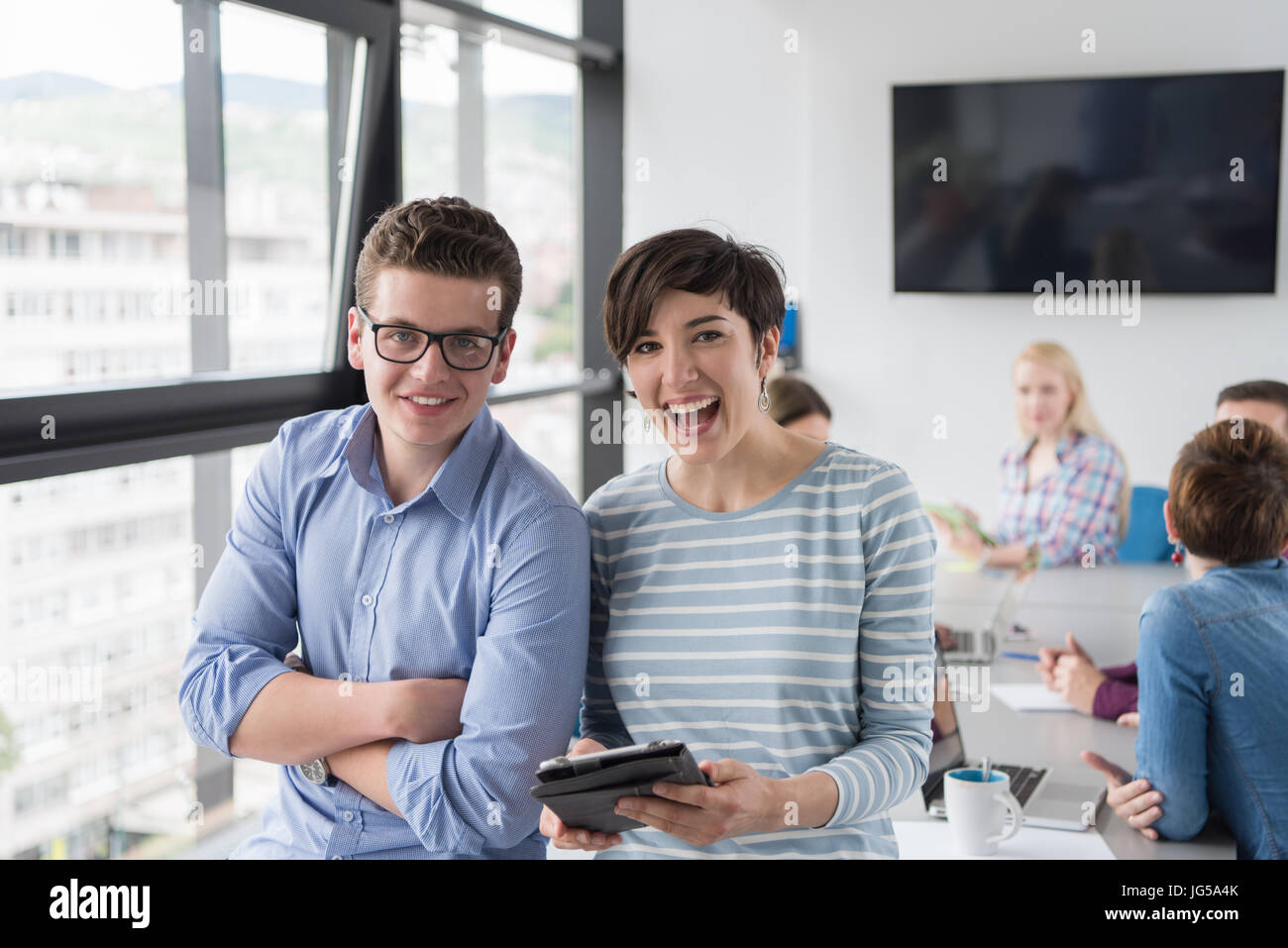 two business people using tablet preparing for next meeting and ...