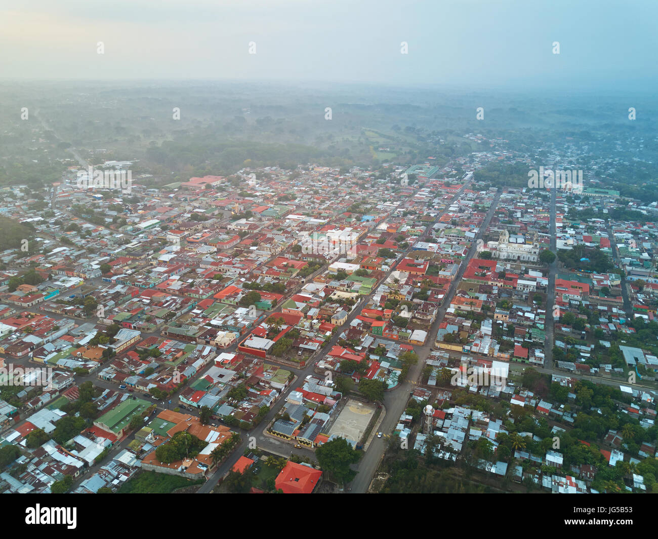Small city blocks aerial view in morning sunrise light time. Drone view ...