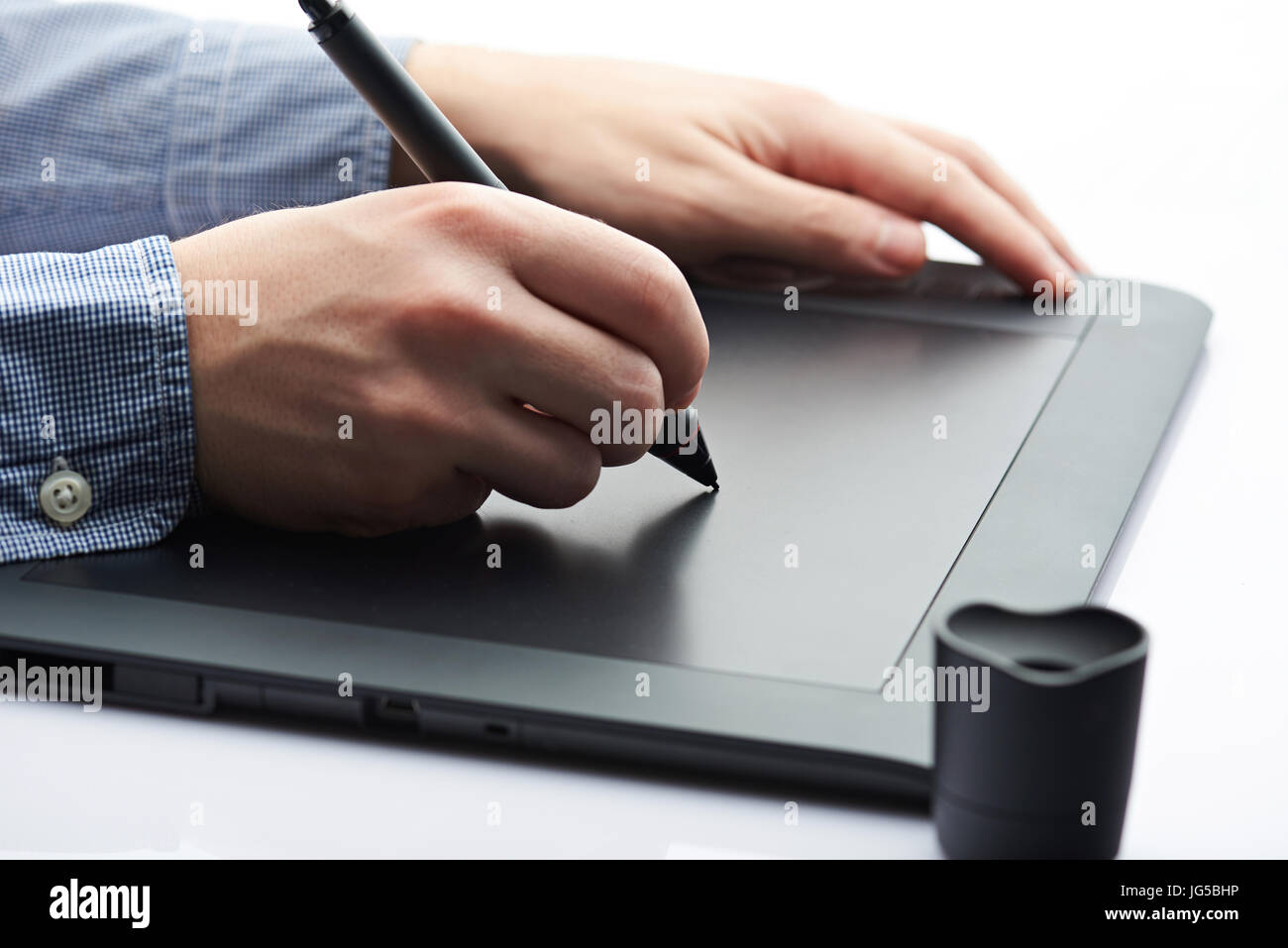 Closeup of graphic designer tablet isolated on white background. Artist ...