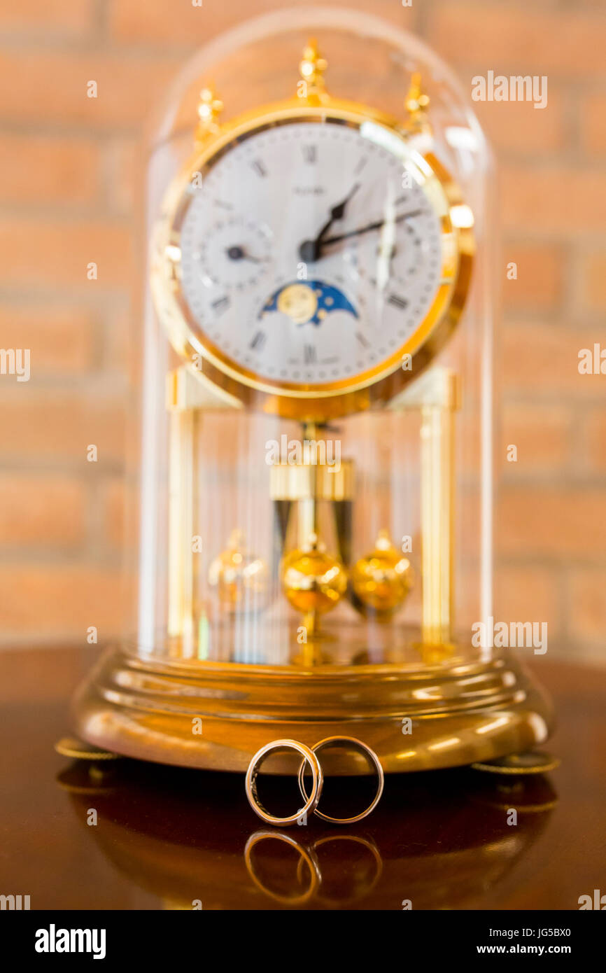 500px Photo ID: 191280991 - wedding rings and clock Stock Photo - Alamy