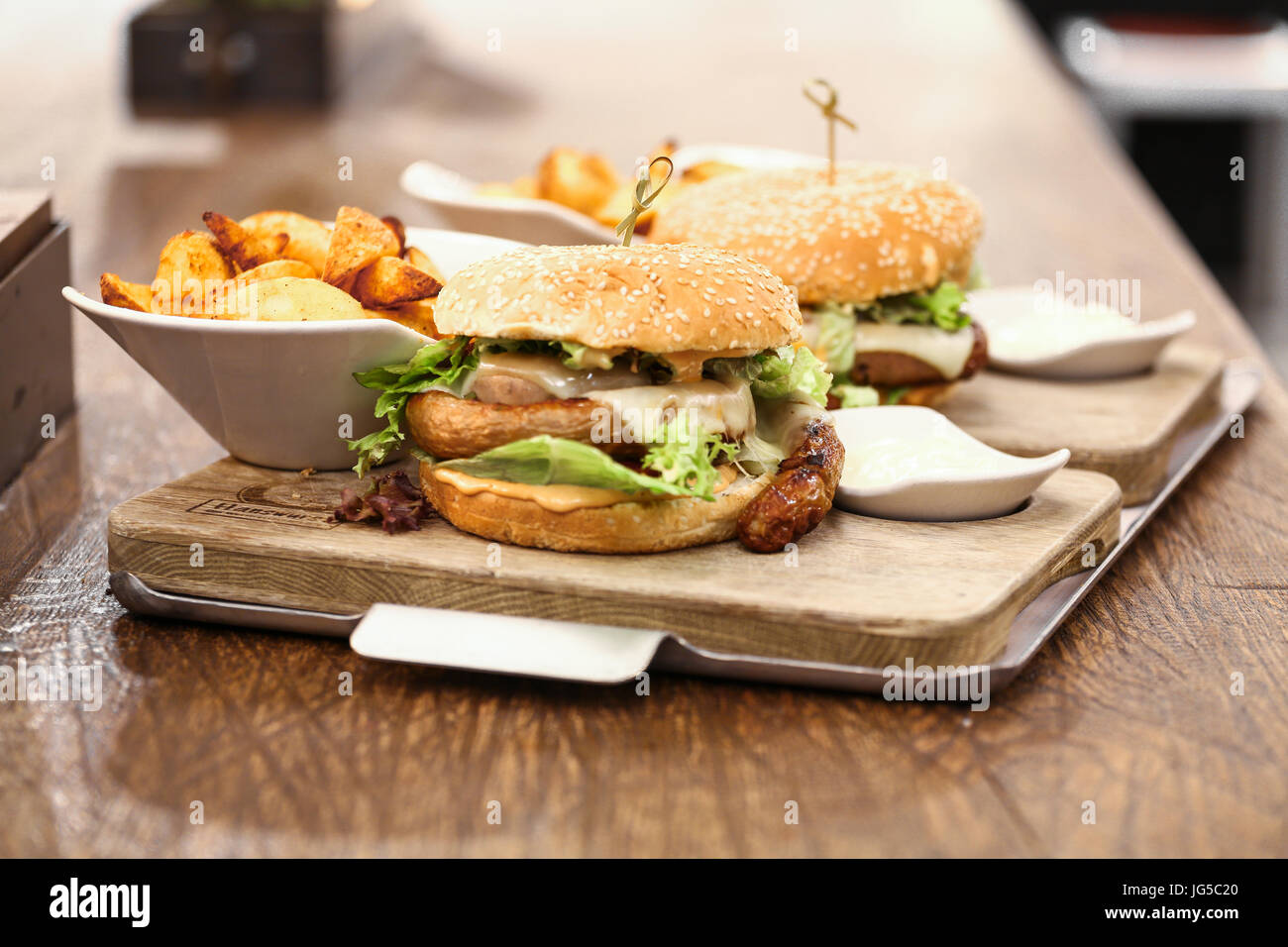 Two delicious wurst burgers served with french fries, Germany Stock ...