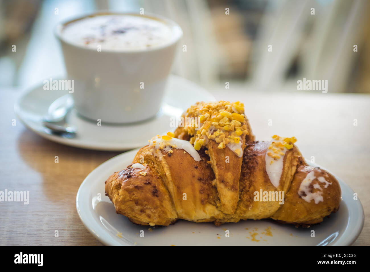 Saint martin croissant and cup of coffee. Rogal marcinski in coffe shop ...