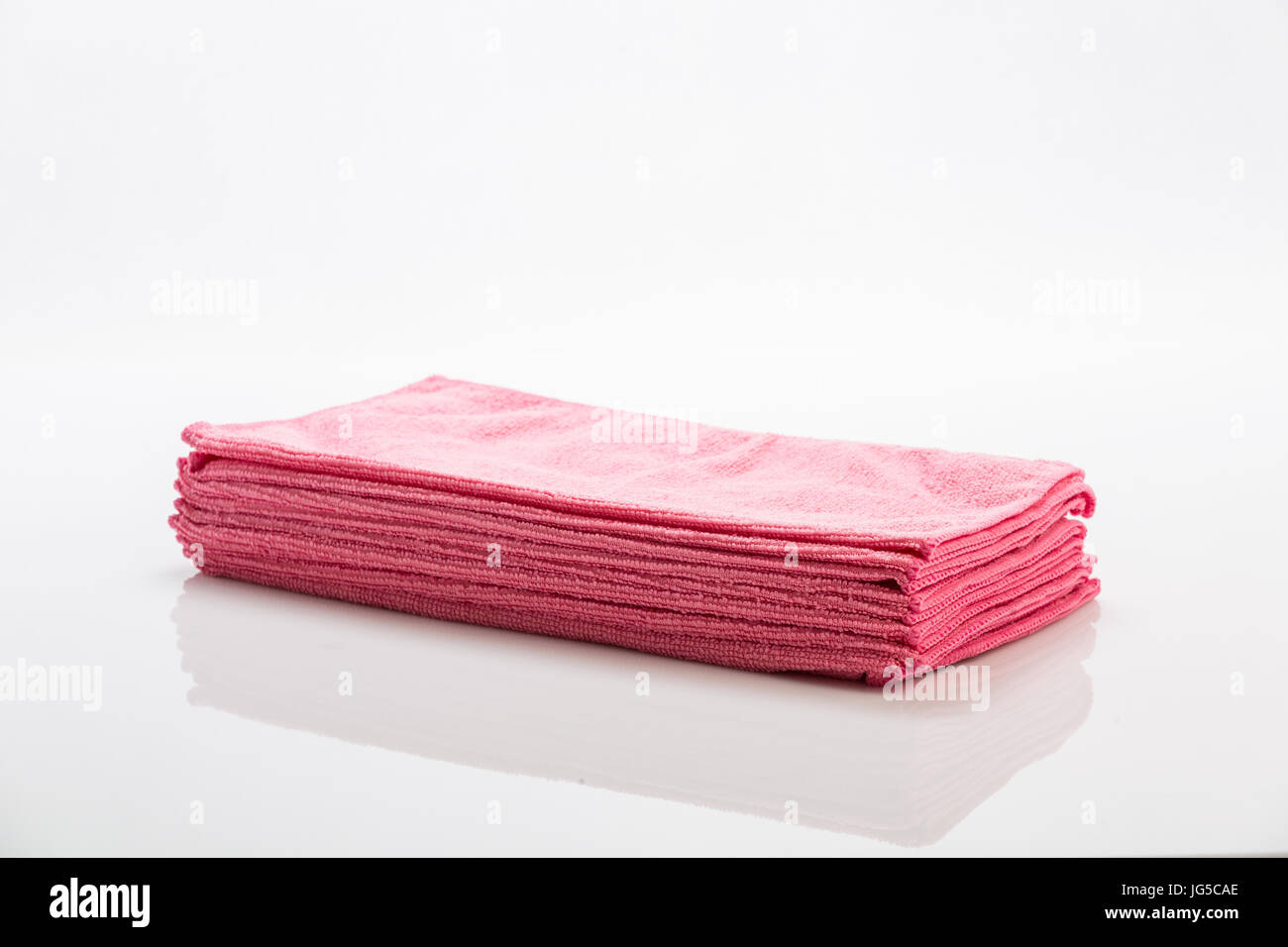 Pink cleaning clothes isolated on white background Stock Photo - Alamy