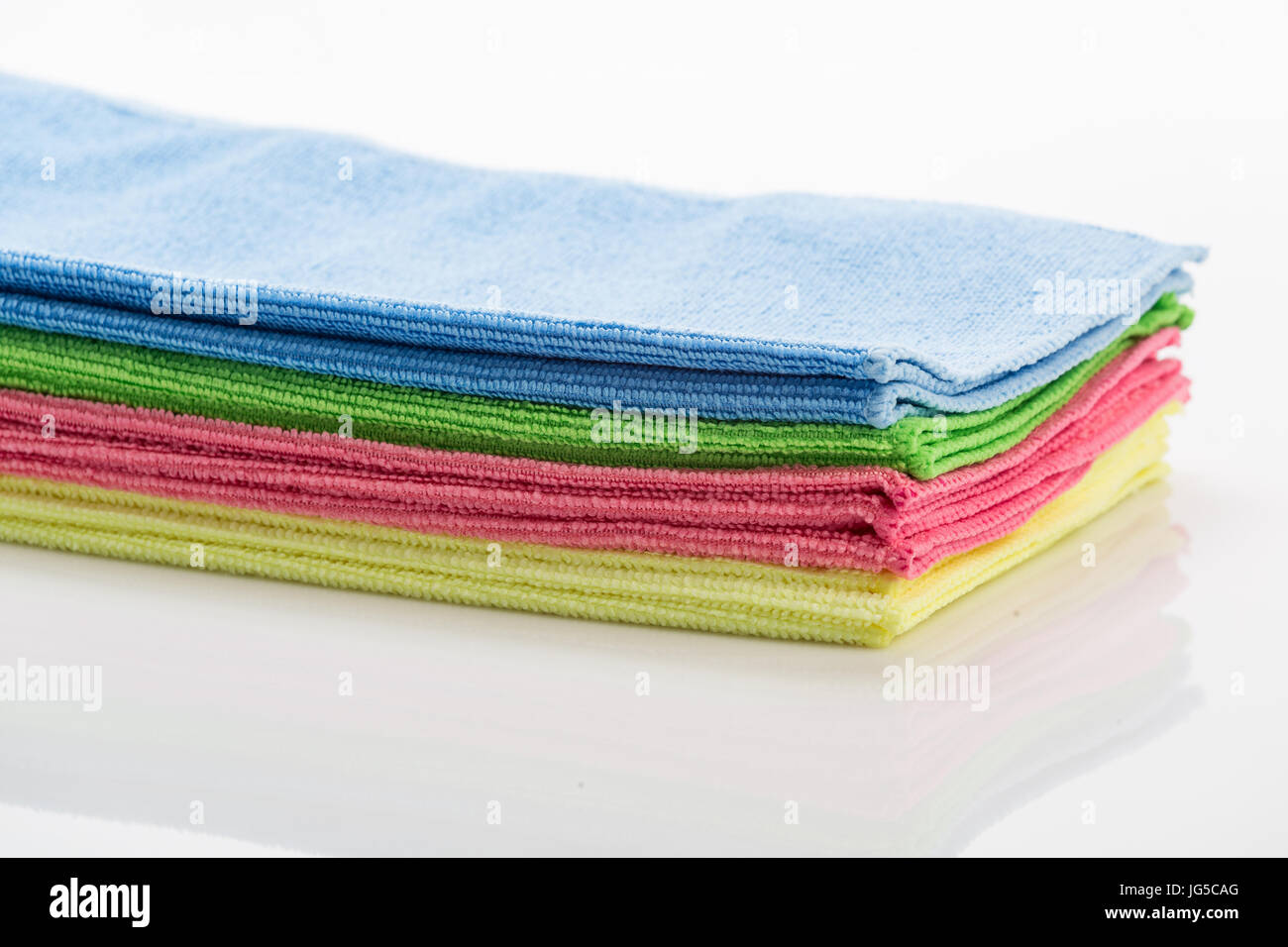 Cleaning clothes in different colors on stack Stock Photo - Alamy