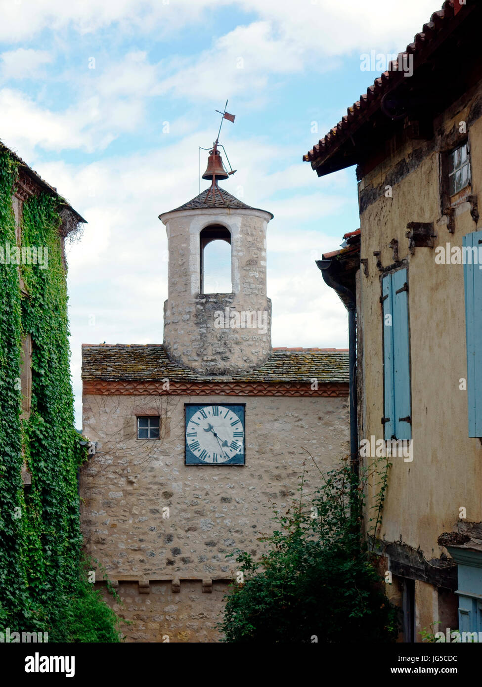 Historic city gate with clocktower in the village of Cordes-sur-ciel ...