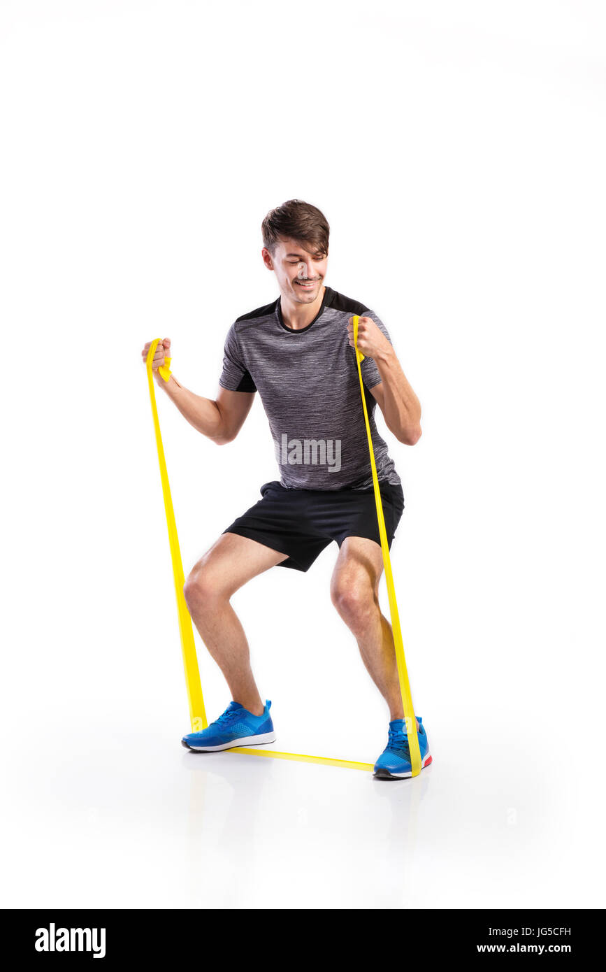 Resistance band man exercise squat Cut Out Stock Images & Pictures - Alamy