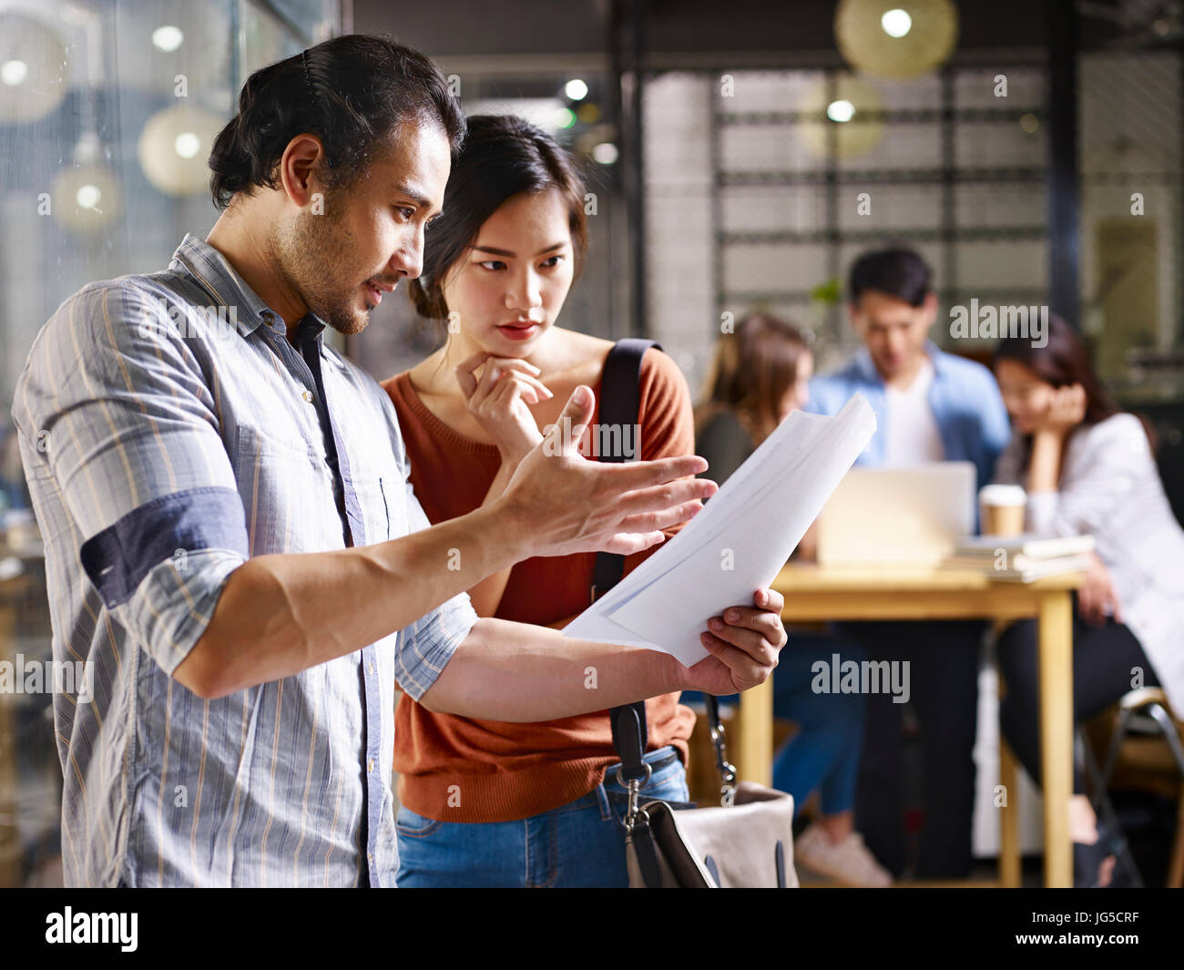 people in small start-up company discussing business in office Stock ...