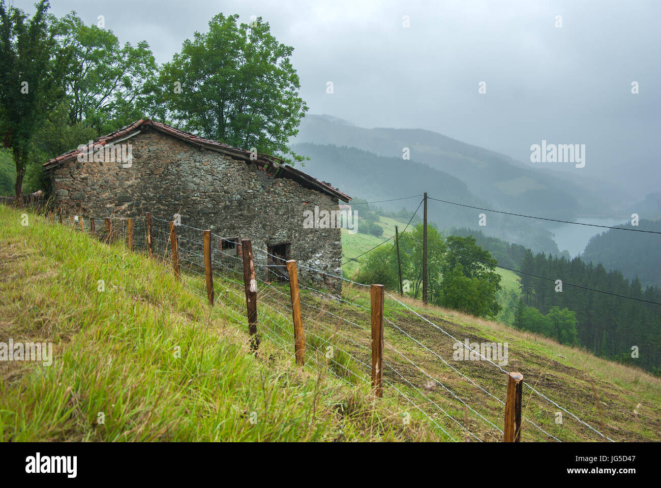 Stone house on the reservoir of Arriaran, Basque Country, Spain Stock ...