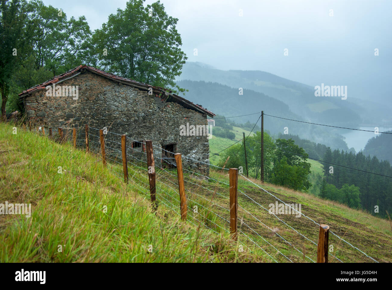 Stone house on the reservoir of Arriaran, Basque Country, Spain Stock ...