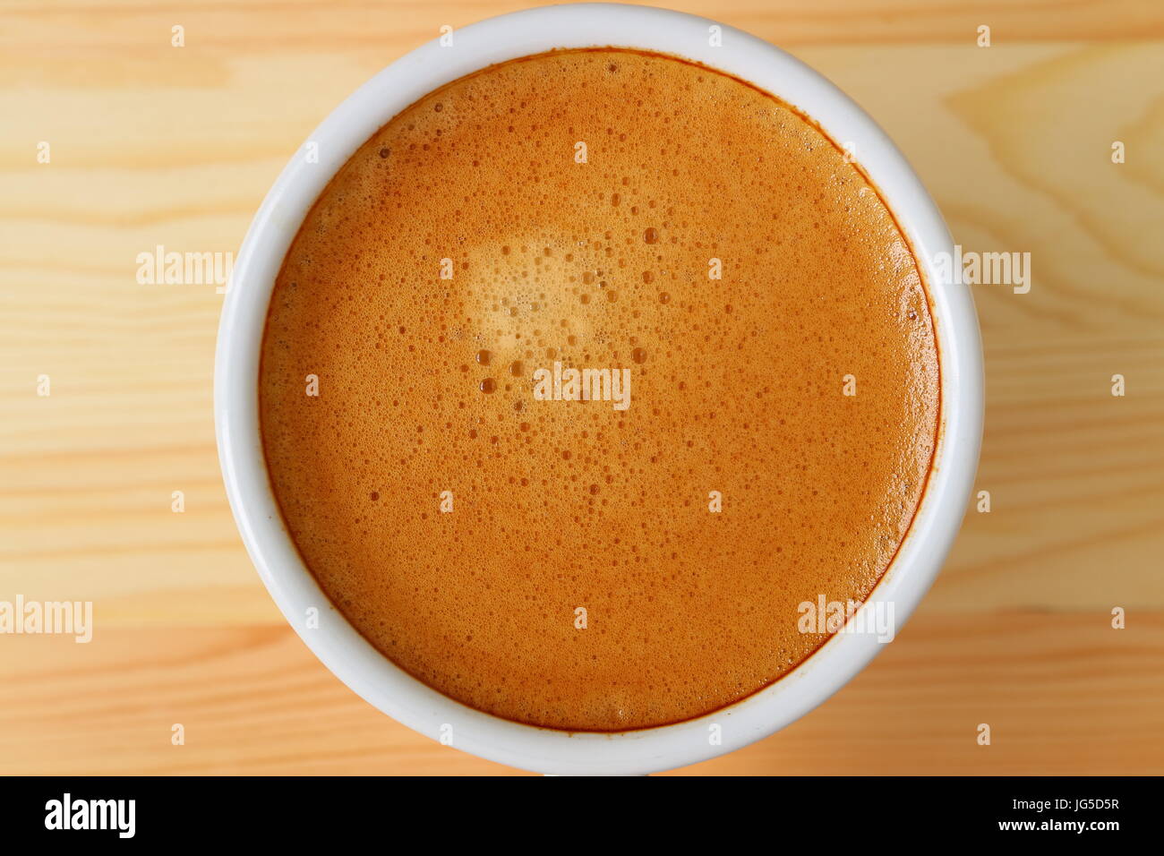 Top view of aromatic Espresso coffee in white coffee cup on wooden ...