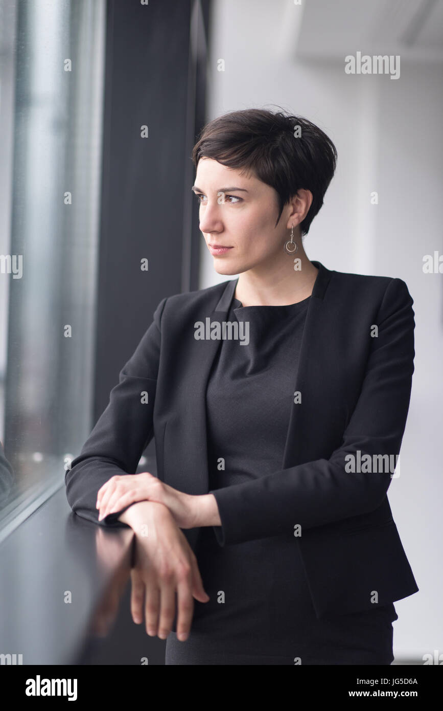 Portrait Of Successful Businesswoman by the window Entrepreneur At Busy ...