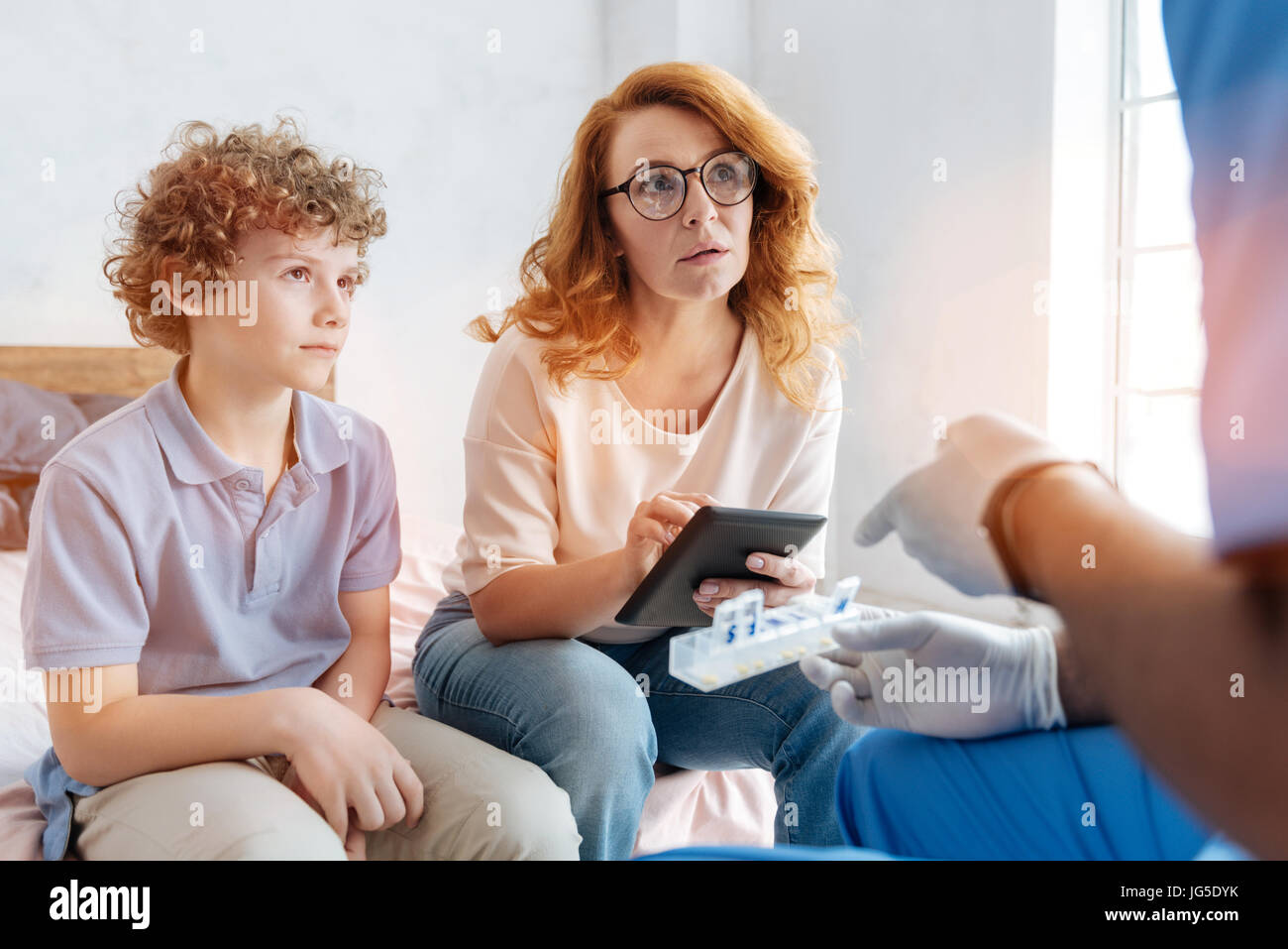 Attentive female person sitting with opened mouth Stock Photo - Alamy