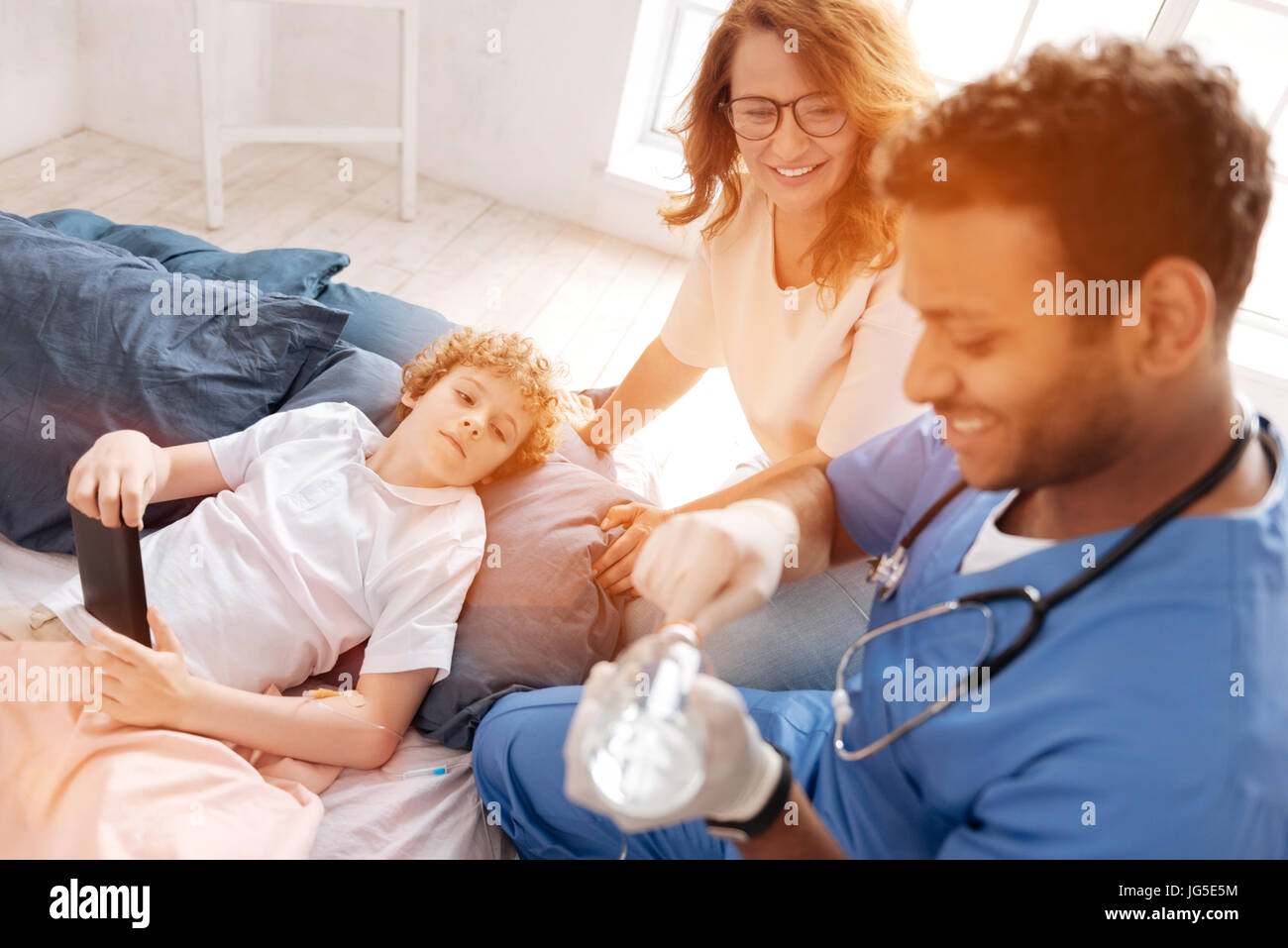 Top view of people that being near sick boy Stock Photo - Alamy