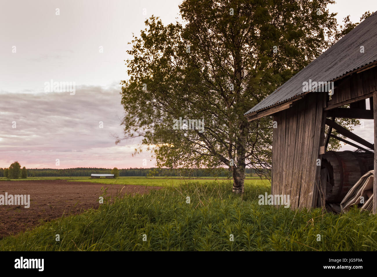 The midsummer sun doesn't set but colors the sky beautifully. The ...