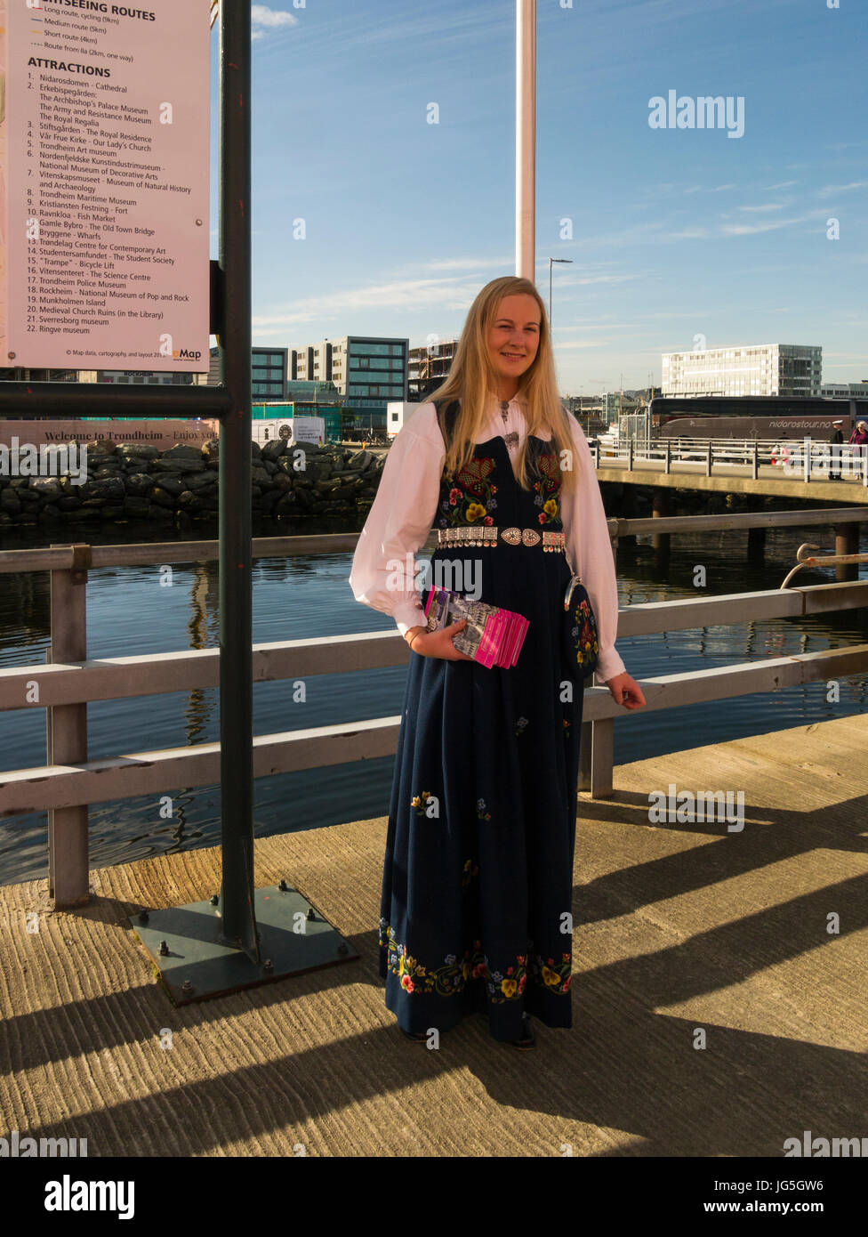 Young lady in Norwegian national dress welcoming visitors to Trondheim ...