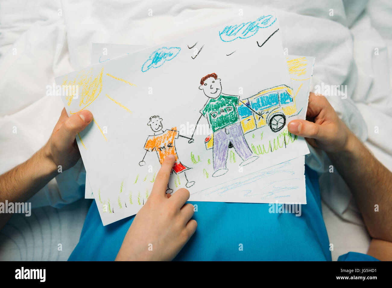 little son showing sick father his drawings at ward, dad and son Stock ...
