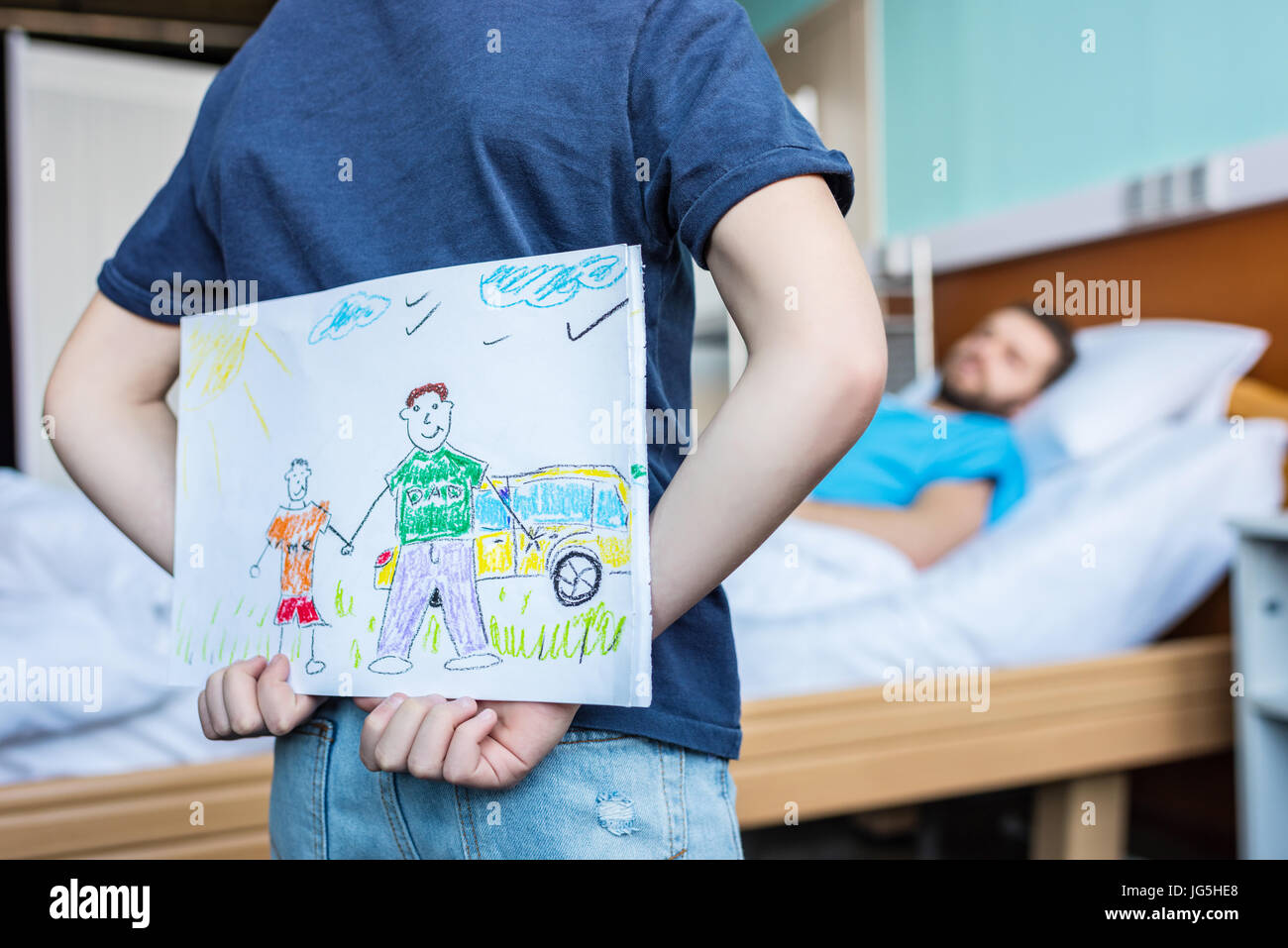 little son showing sick father his drawings at ward, dad and son Stock ...