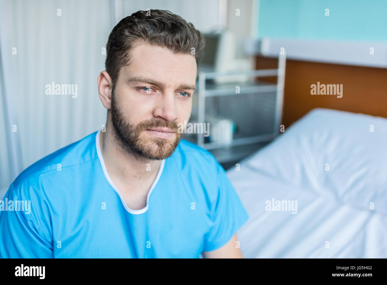 Man sitting on hospital bed hi-res stock photography and images - Alamy
