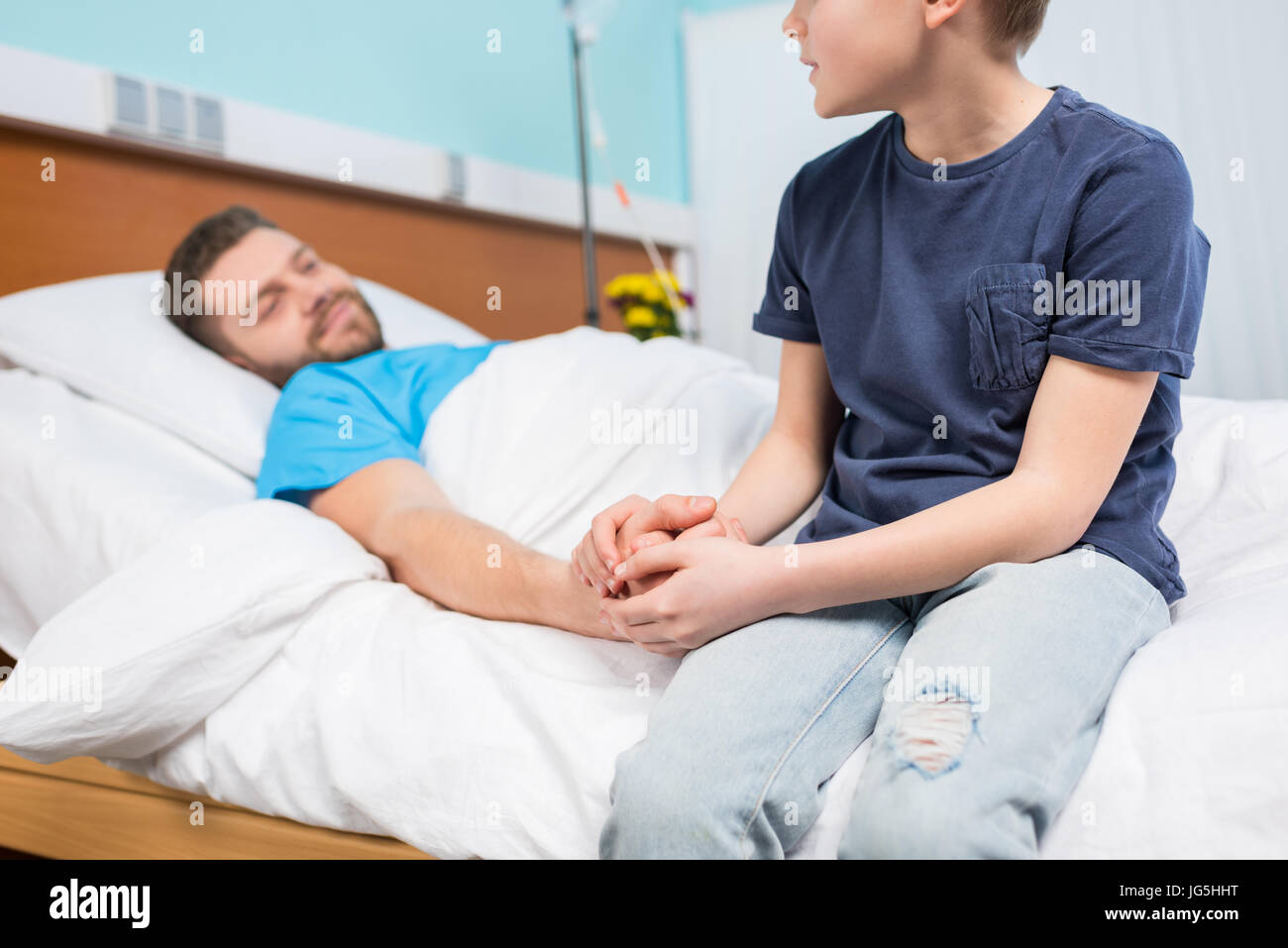 Boy lying in hospital bed hi-res stock photography and images - Alamy