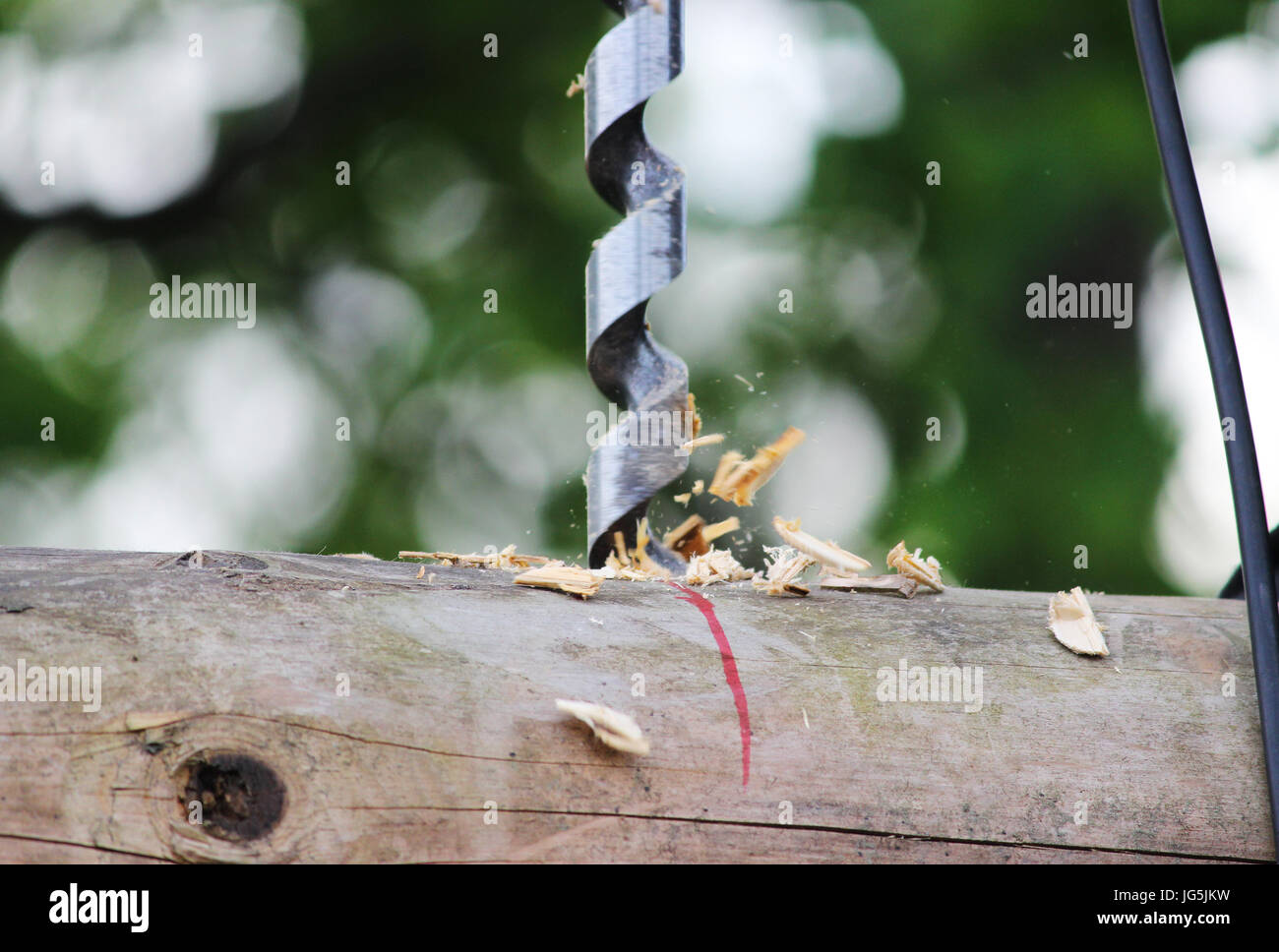 Metal spiral drill for making holes in logs when assembling a wooden ...