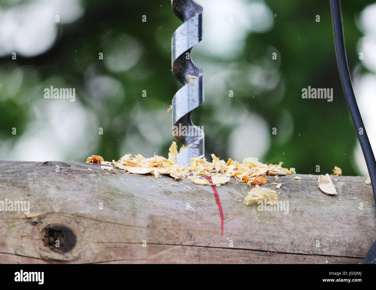 Metal spiral drill for making holes in logs when assembling a wooden ...