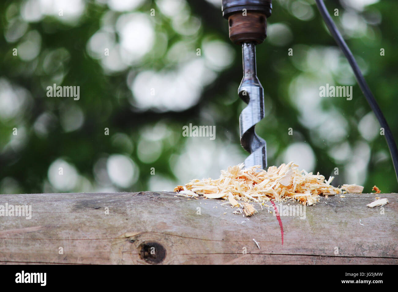 Metal spiral drill for making holes in logs when assembling a wooden ...