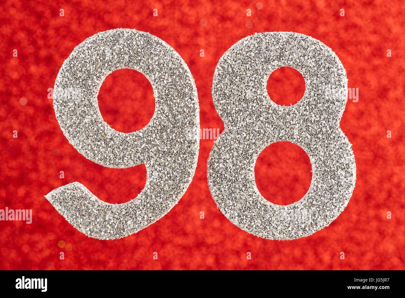 Number ninety-eight silver color over a red background. Anniversary ...