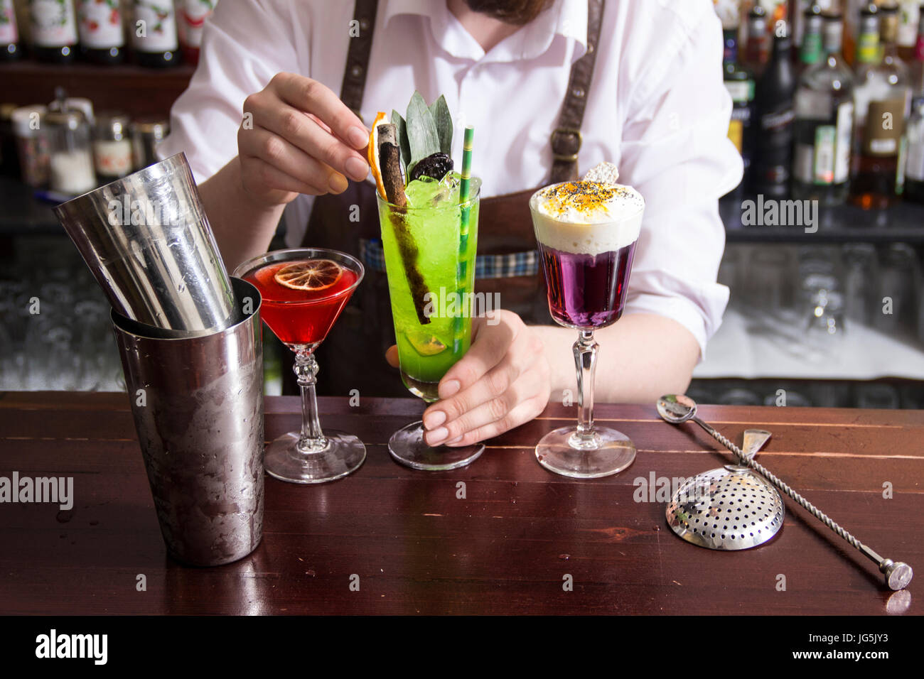 close up of bartender making alcohol coctail in restaurant Stock Photo ...