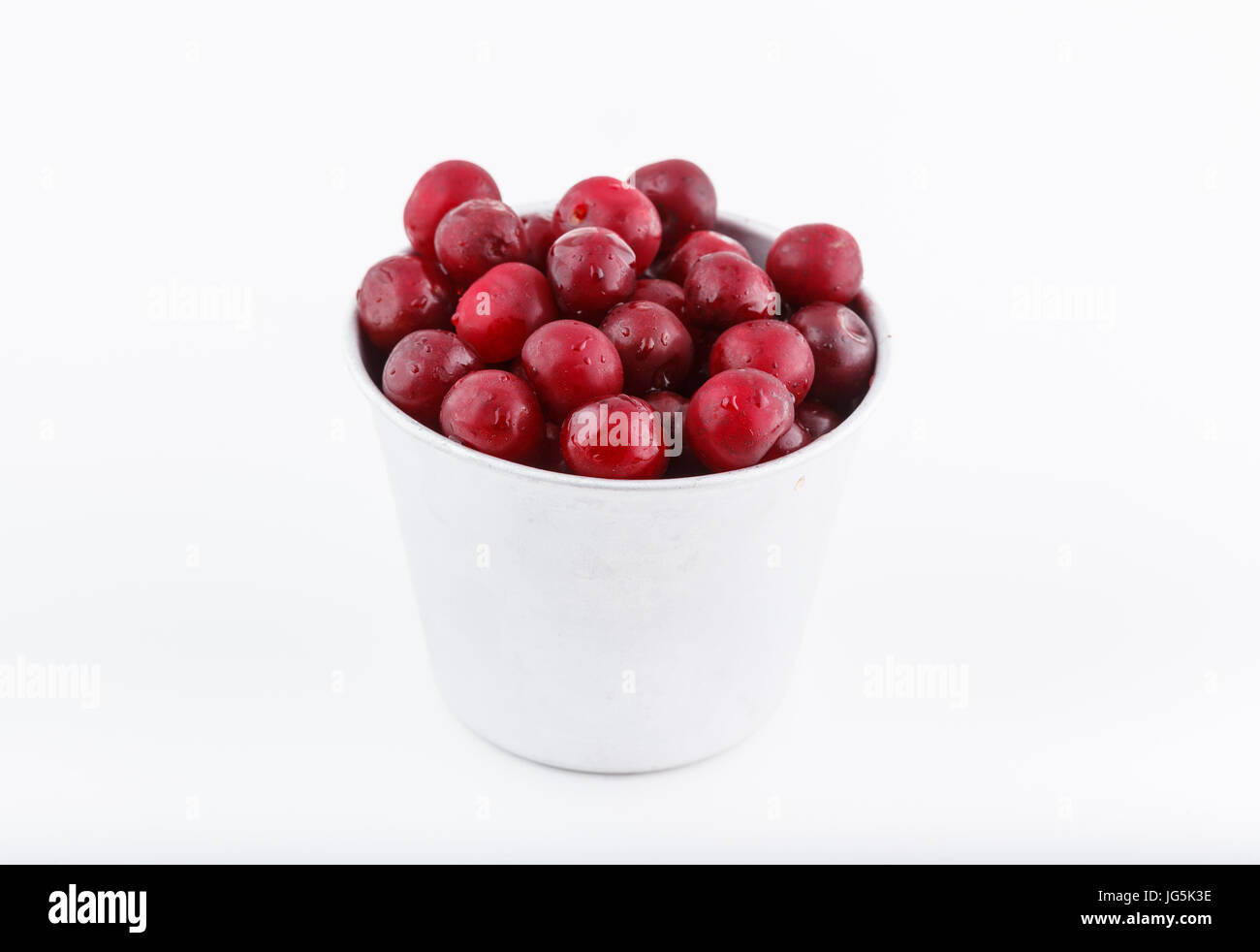 Red morello cherries stacked in an old grey metal pot Stock Photo - Alamy