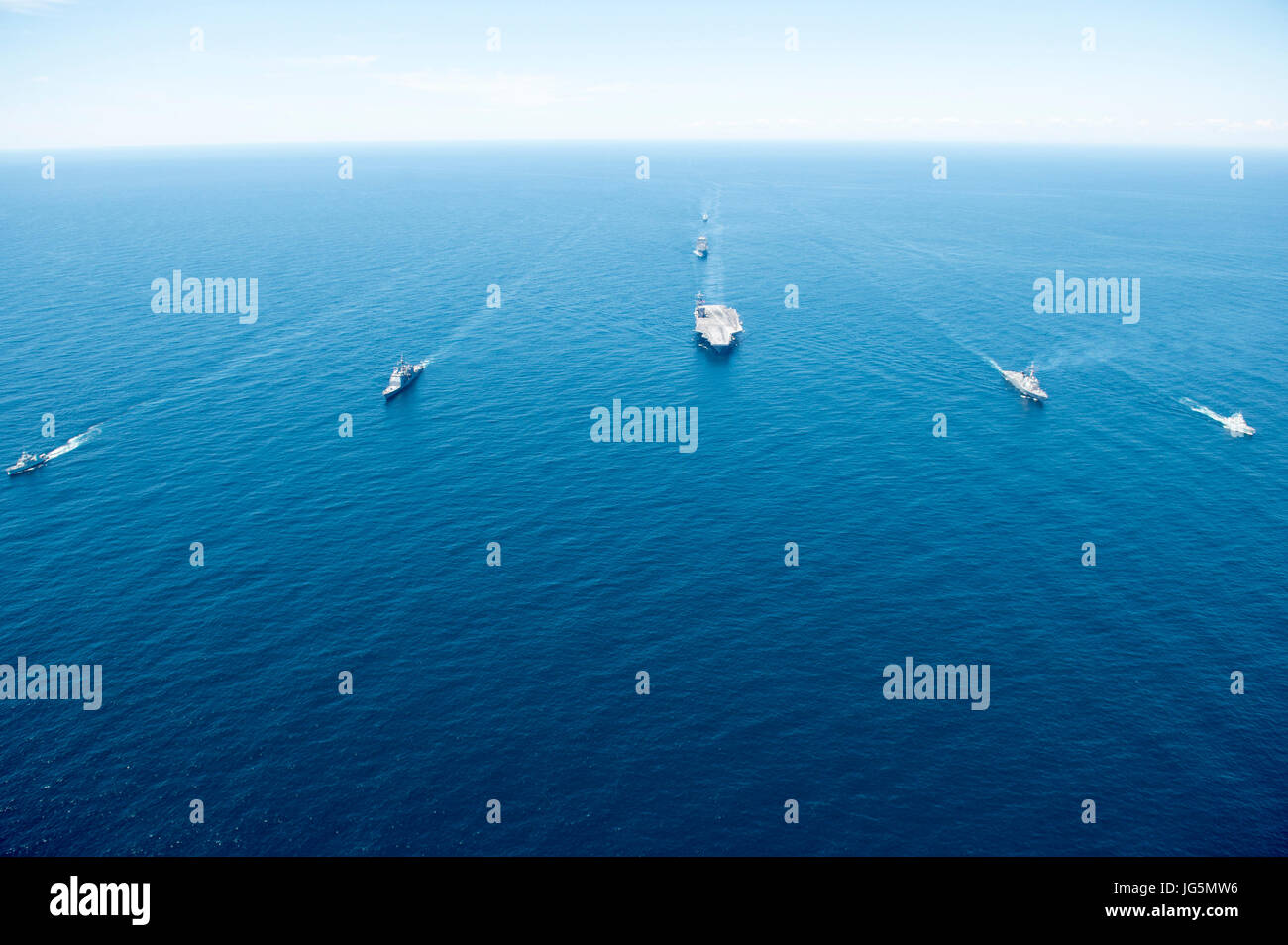 A multinational naval task force including the aircraft carrier USS ...