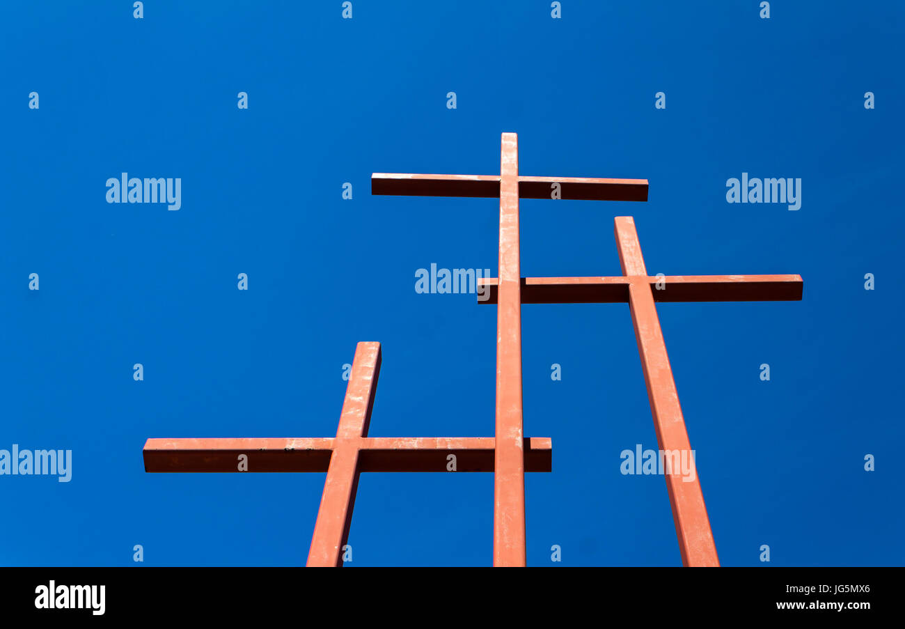 Three red crosses on a blue sky background Stock Photo - Alamy