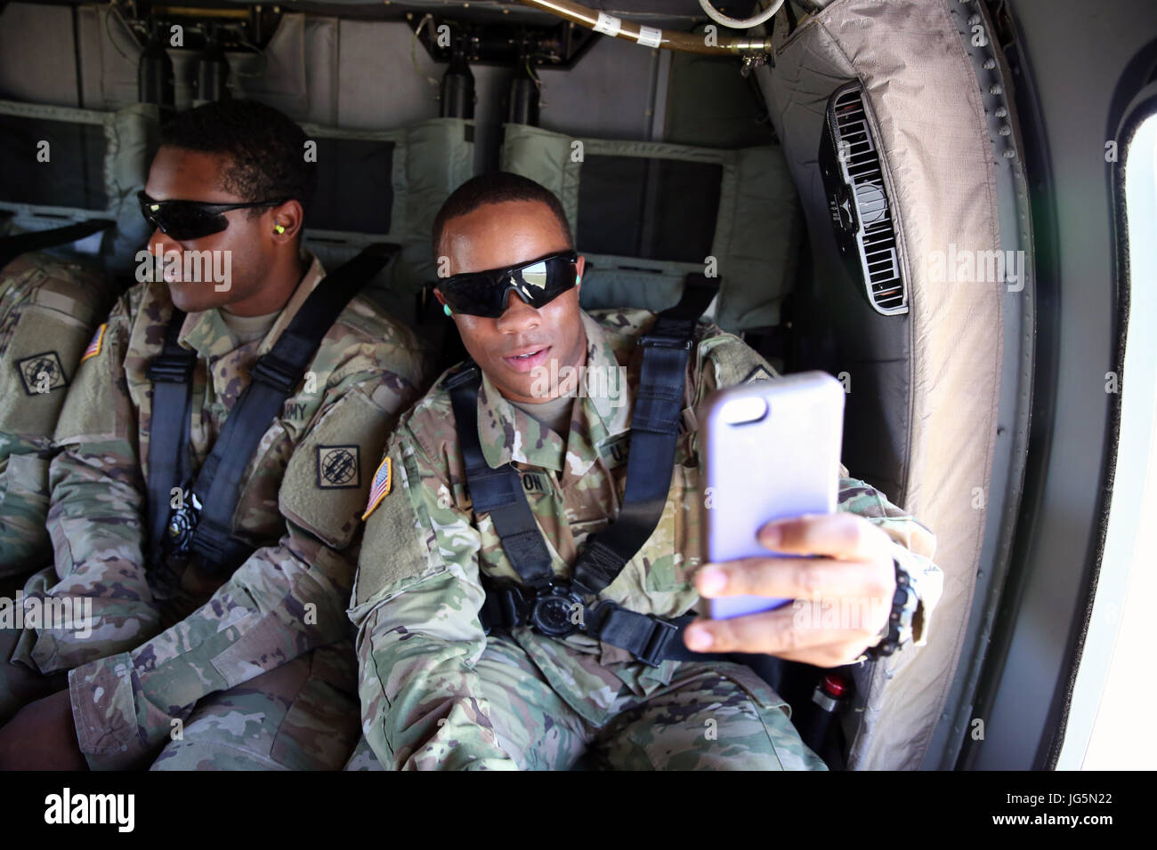 U.S. Army Spc. Jumoke Robinson, assigned to Charlie Company, 44th Expeditionary Signal Battalion ...